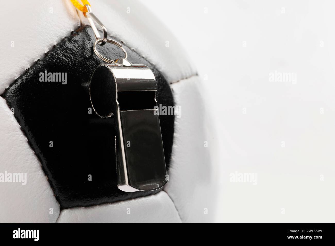 Football referee equipment. Soccer ball and whistle on white background ...