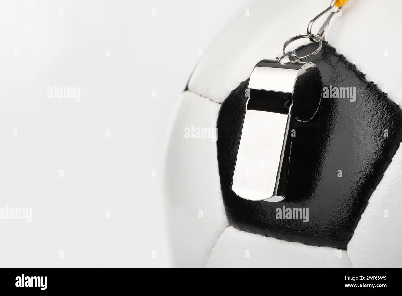 Football referee equipment. Soccer ball and whistle on white background ...
