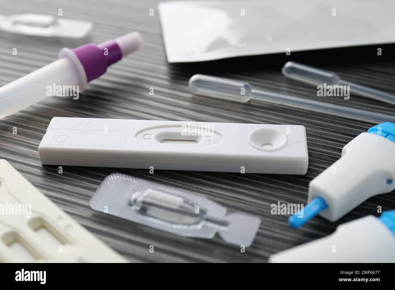 Disposable express test kits on black wooden table, closeup Stock Photo ...
