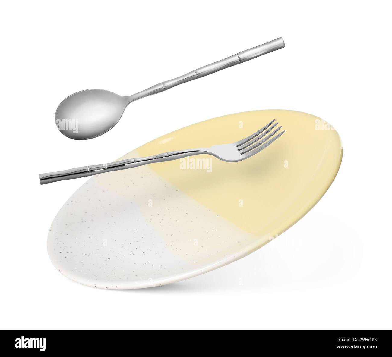 Clean plate, fork and spoon falling on white background Stock Photo - Alamy