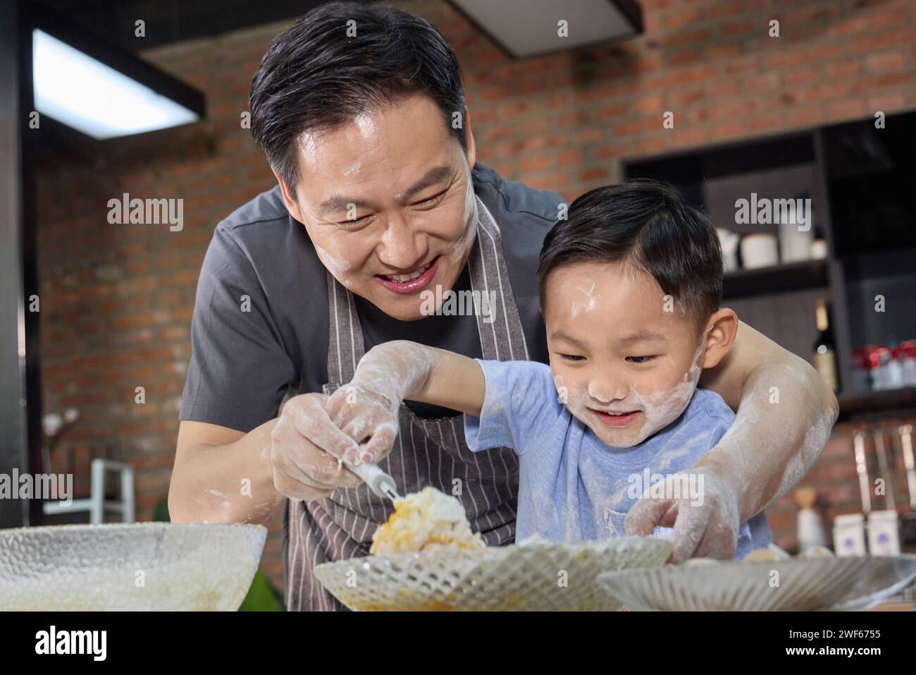 Father and son baking together Stock Photo - Alamy