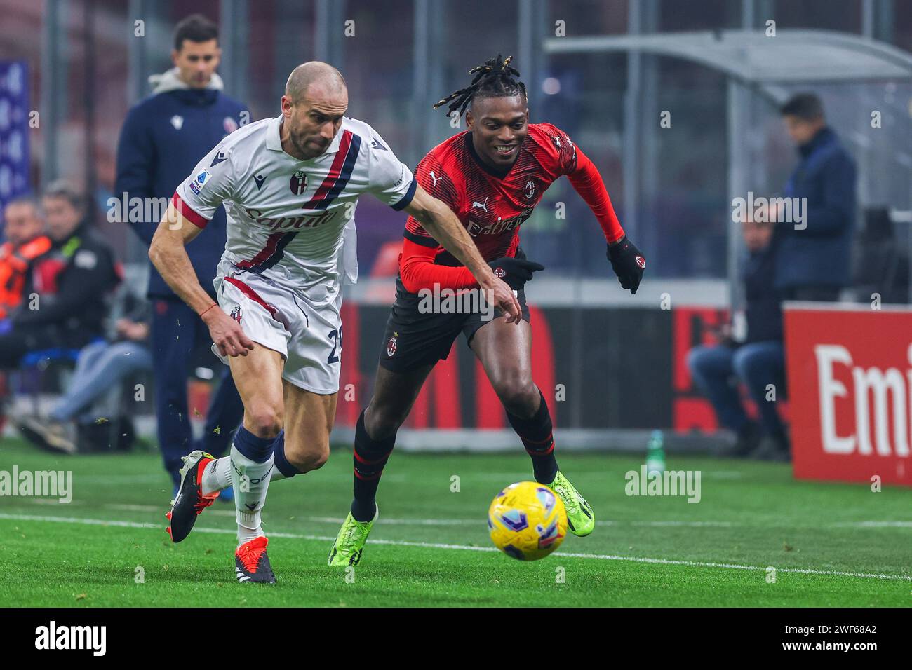 Milan, Italy. 27th Jan, 2024. Rafael Leao of AC Milan (R) and Lorenzo ...