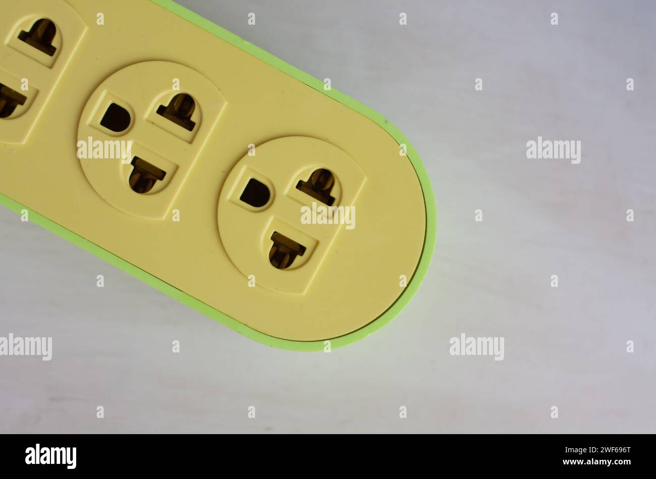 yellow power boards on white wood background Stock Photo - Alamy