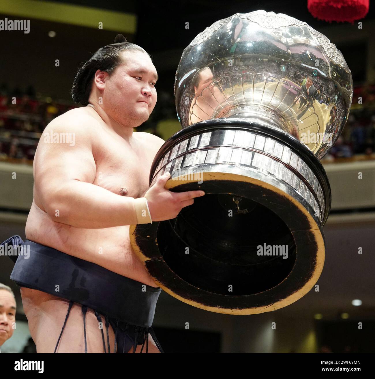 Yokozuna Terunofuji of Mongolia receives a victory trophy during Tokyo ...