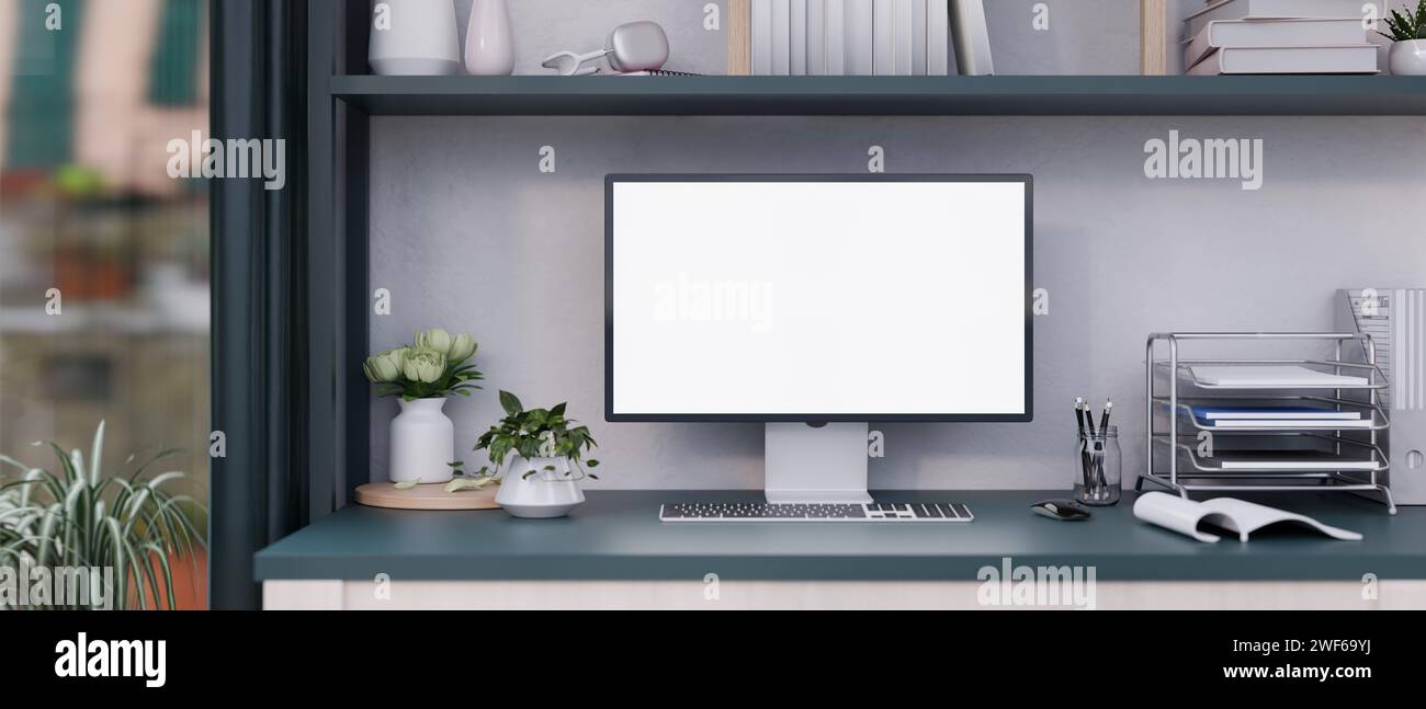 Front view of a white-screen computer mockup and office supplies on a ...