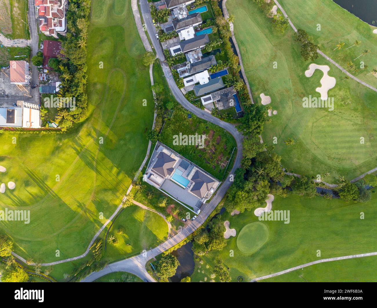 Aerial view of beautiful green golf field fairway and putting green ...