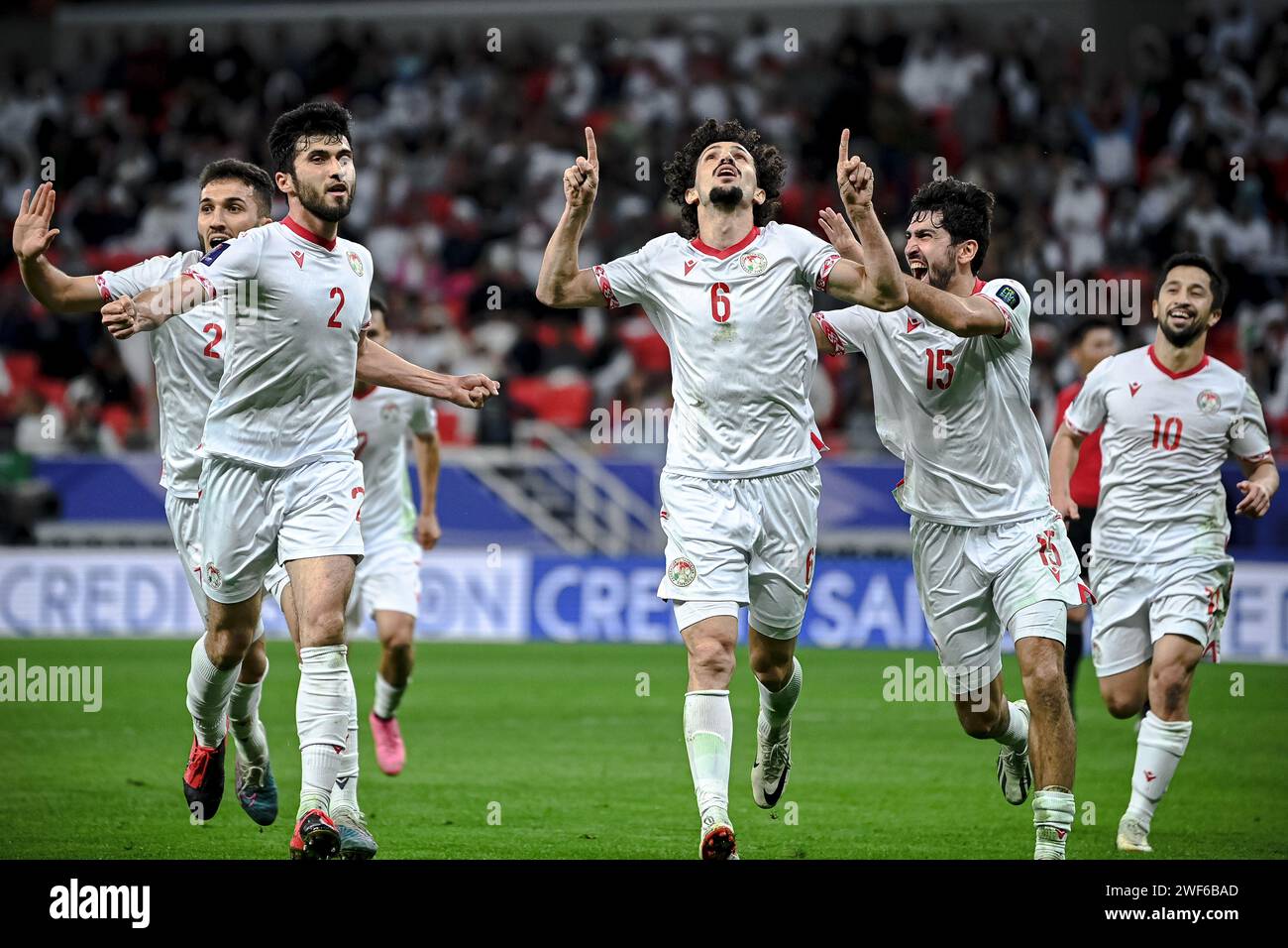 Doha, Qatar. 28th Jan, 2024. Vahdat Hanonov (3rd R) of Tajikistan ...