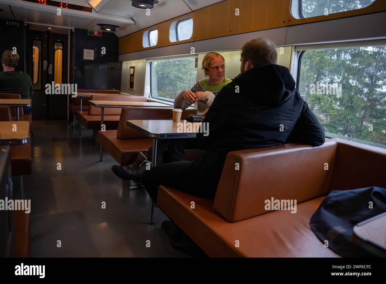 Two people are seen eating food and enjoying the scenery in the ...