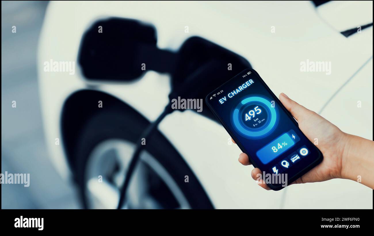 Smartphone display battery status on smart EV mobile application while ...