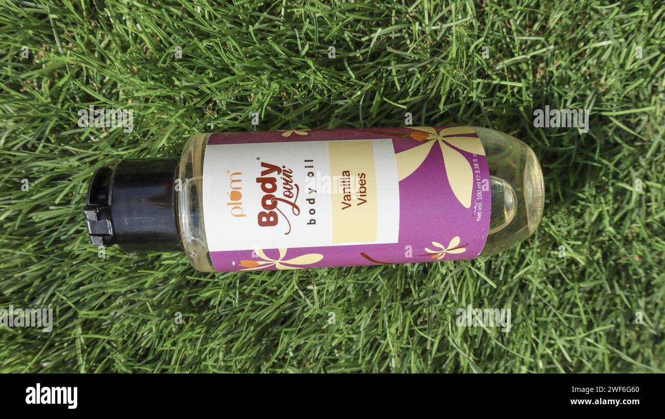 Plum body oil with Vanilla fragrance. Bottle of body oil moisturising ...