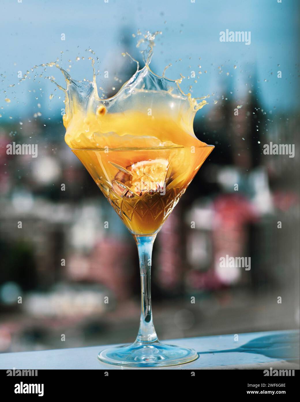 Pornstar Martini Cocktail splash with passion fruit Stock Photo - Alamy