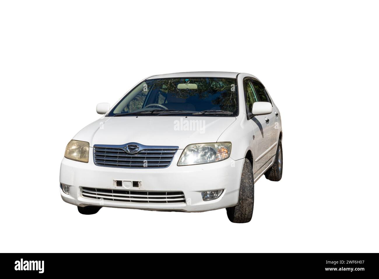 Japanese white Toyota Corolla 2006 front view on white isolated ...