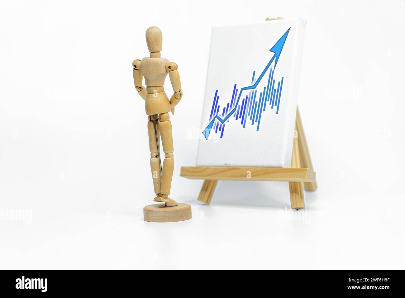 Mannequin drawing a graph charts on easel; isolated on white background ...