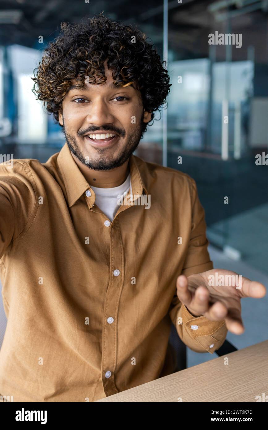 First person view of muslim guy in smart casual clothes having phone ...