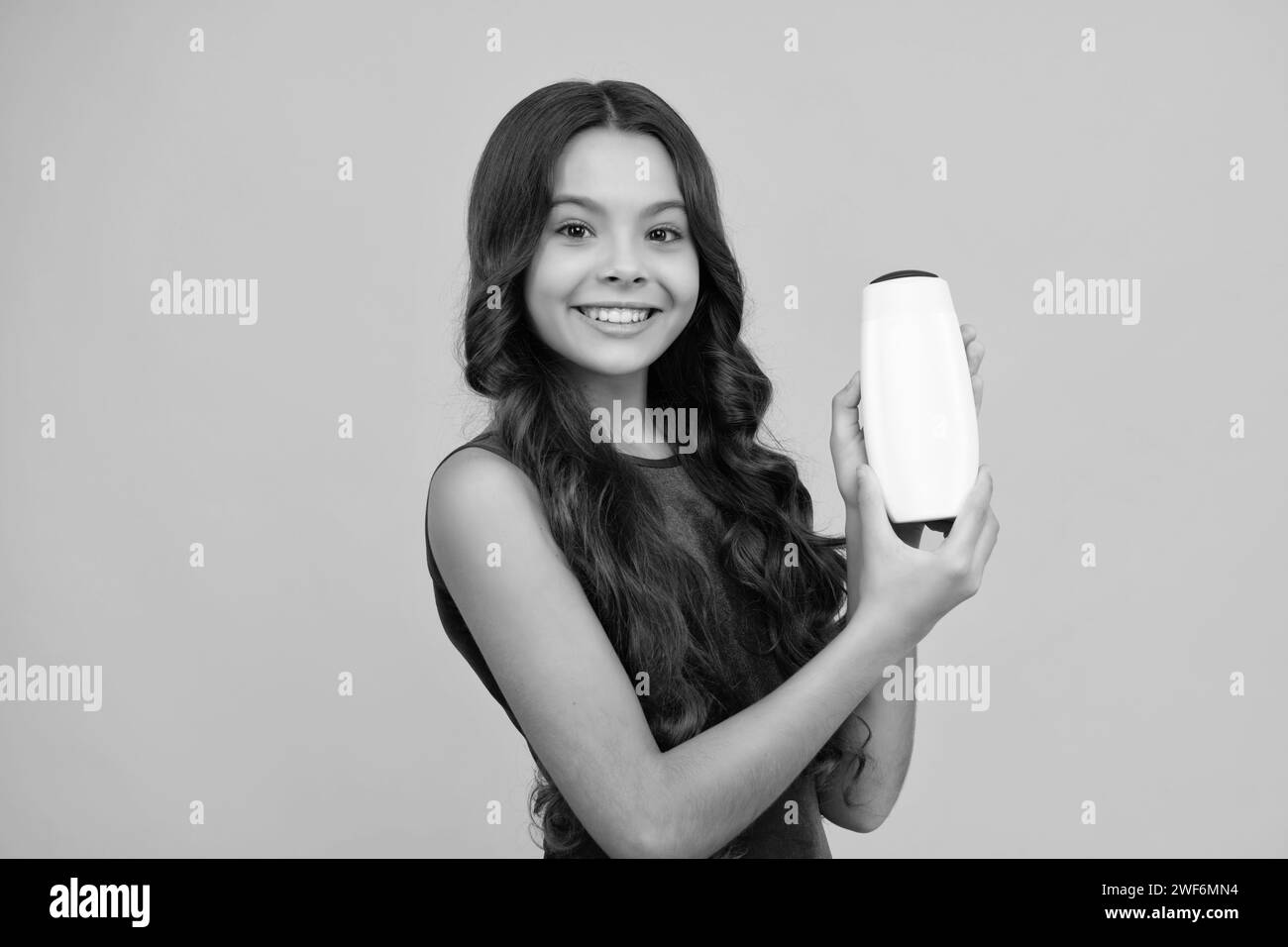 Child teen girl with shampoos conditioners and shower gel. Long hair ...
