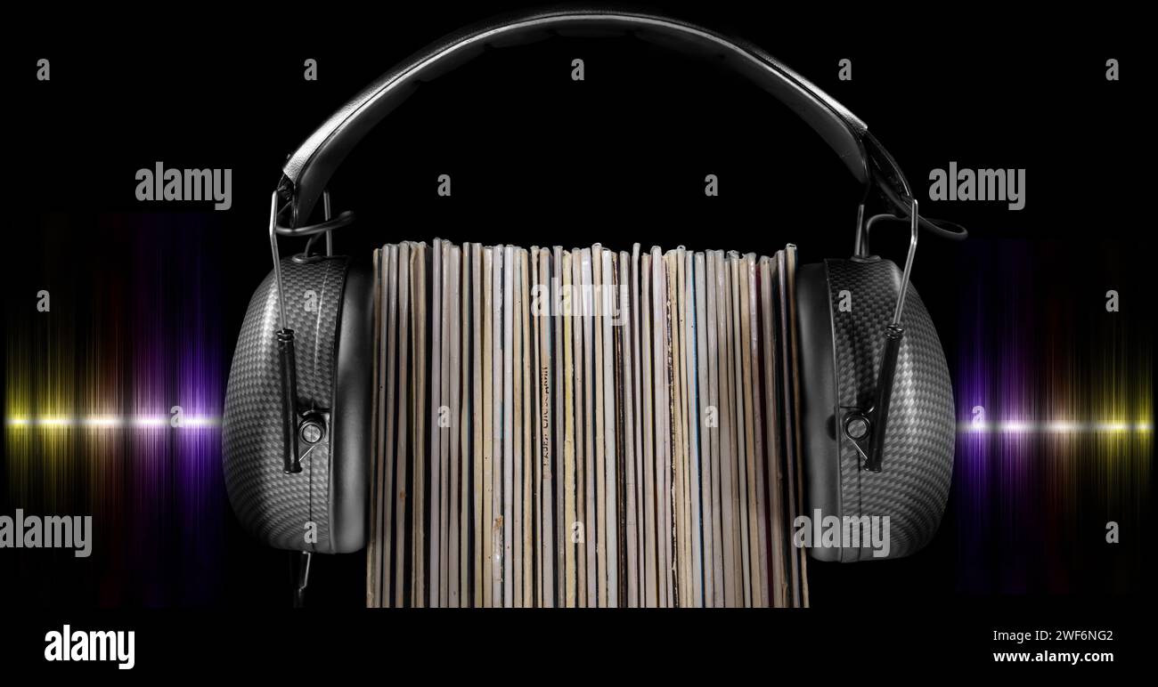 Pile of old vinyl discs, headphones on black background with sound wave ...