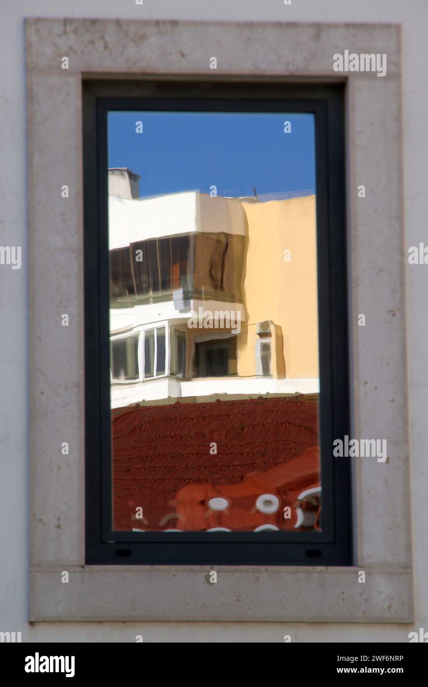 A reflection of a building seen in windows Stock Photo - Alamy