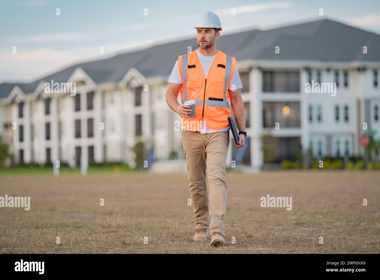 Construction man in helmet build new house. Engineer work in builder ...