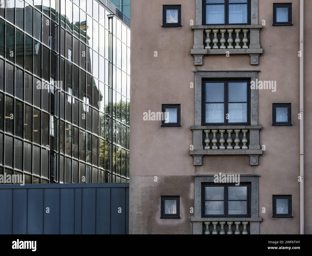 The image depicts the juxtaposition of a classic building with ornate ...