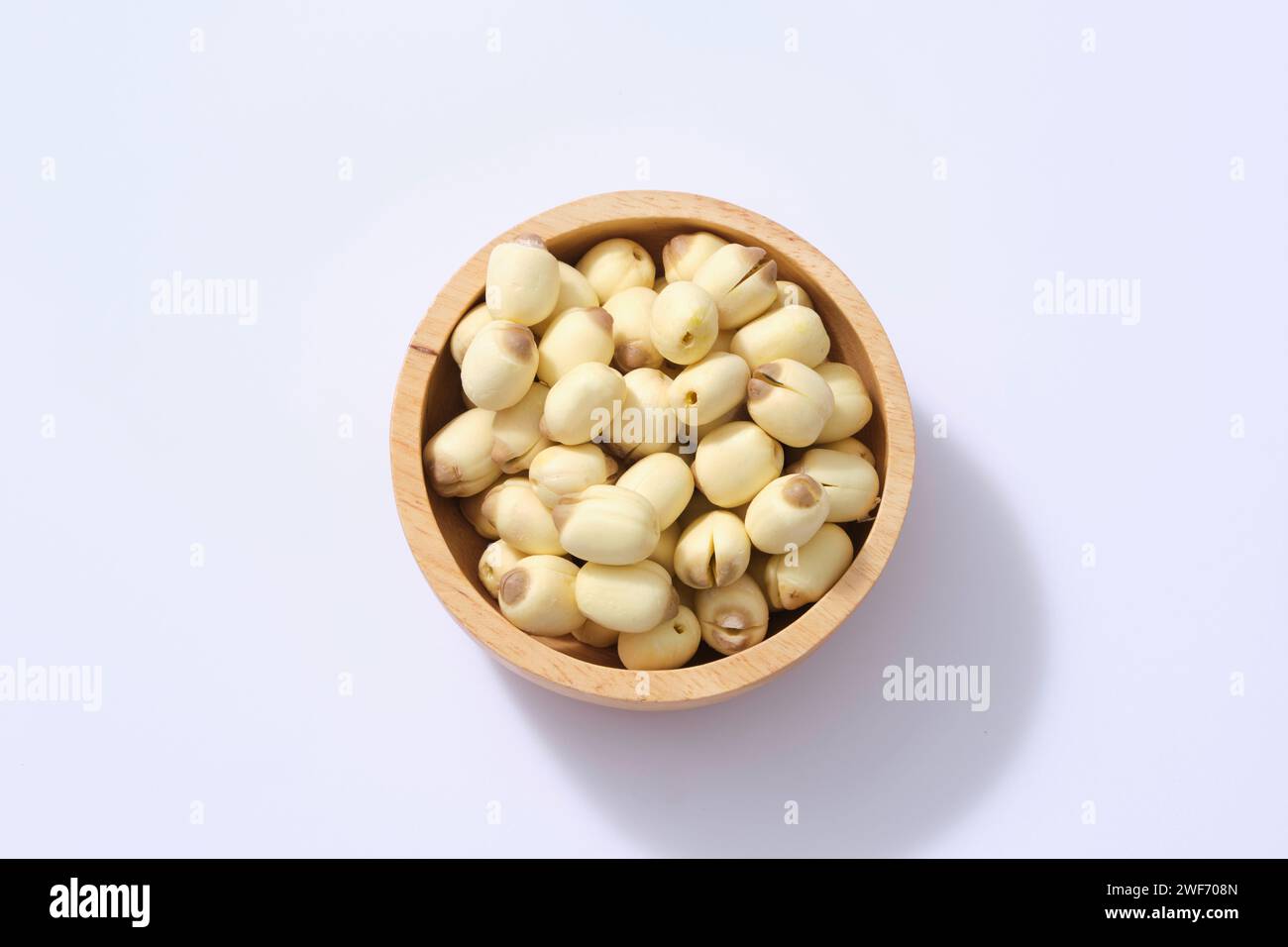 Top view, flat lay of Lotus (Nelumbo nucifera) seeds placed in wooden ...