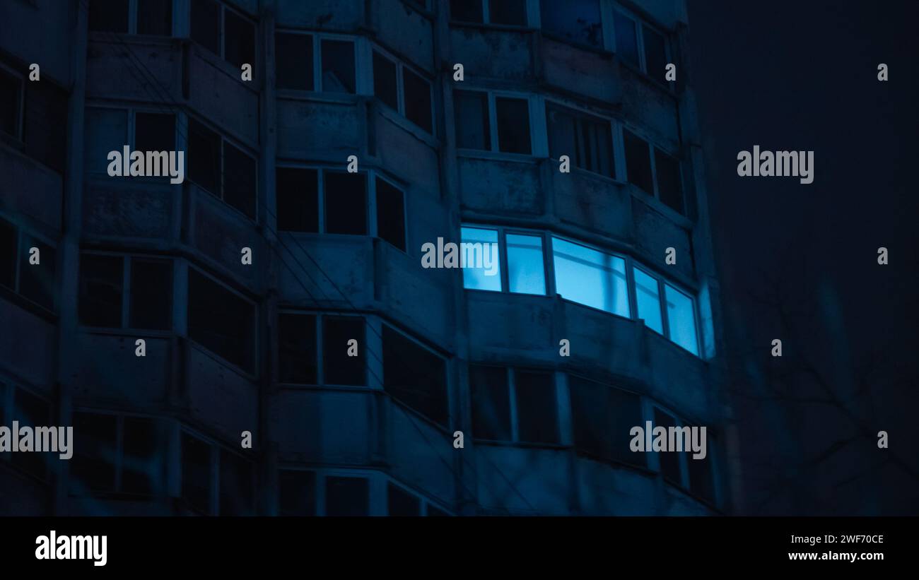 Multistory soviet building at the night with blue light Stock Photo - Alamy