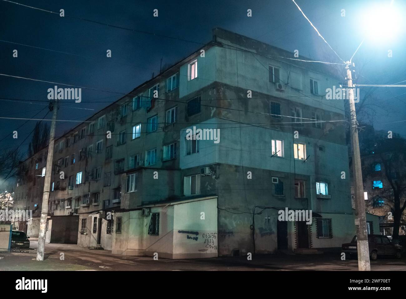 Soviet building at the night with a light in windows Stock Photo - Alamy