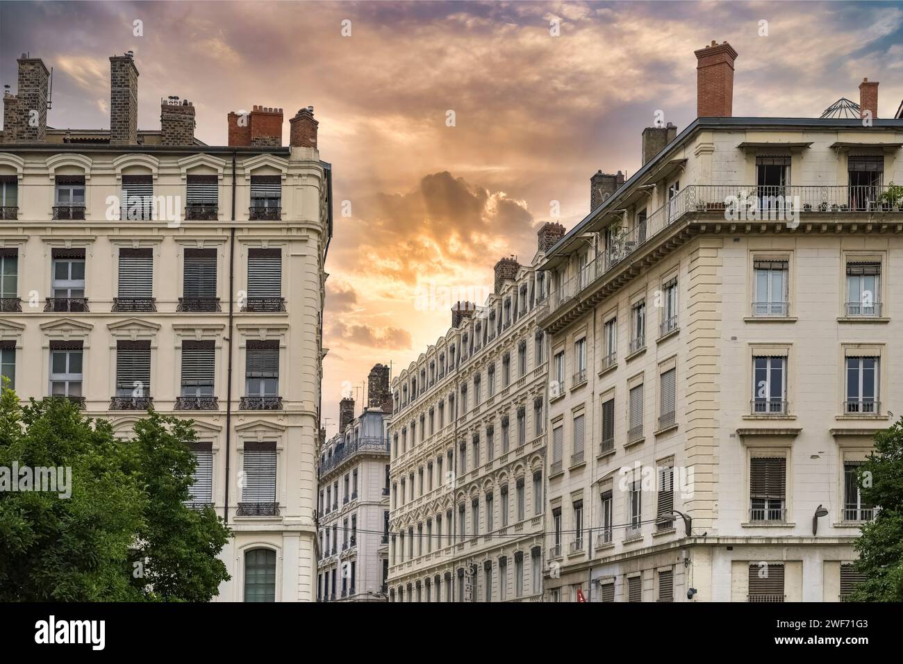 The beautiful buildings of Lyon, France against the blue cloudy sky ...