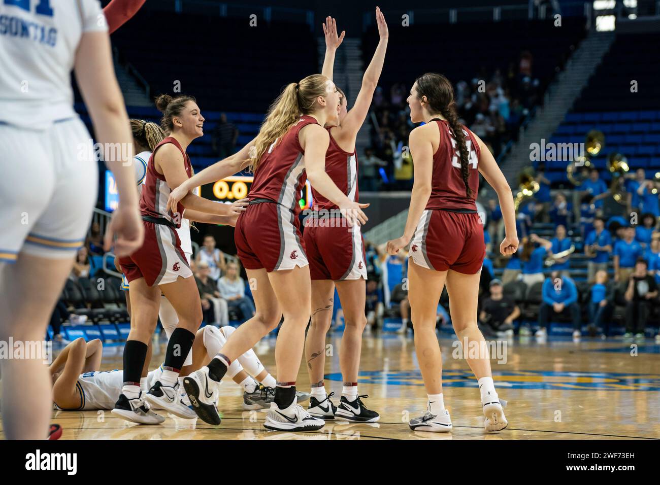 Washington State Cougars guard Jenna Villa (34) celebrates with guard ...