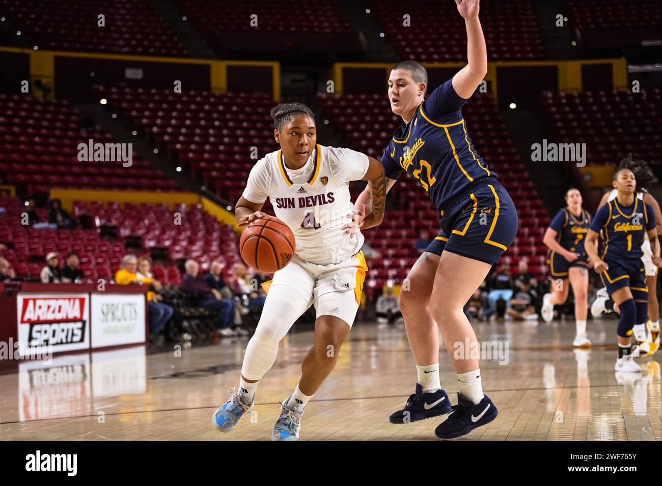 Arizona State Sun Devils guard Trayanna Crisp (4) drives toward the basket in the first half of ...