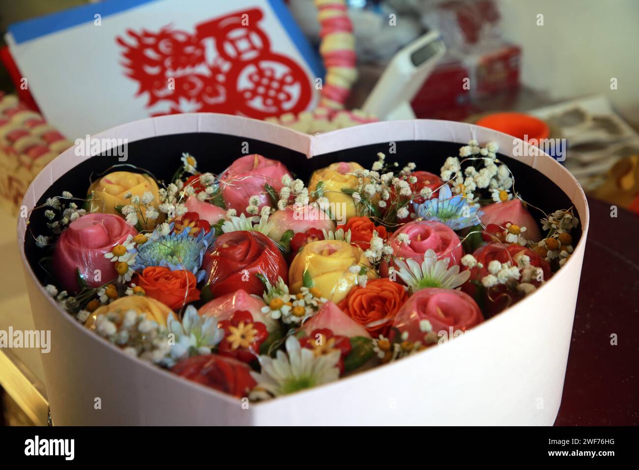 Flower-shaped steamed buns are made to celebrate the Spring Festival in ...