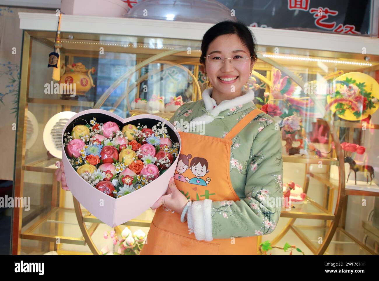Flower-shaped steamed buns are made to celebrate the Spring Festival in ...