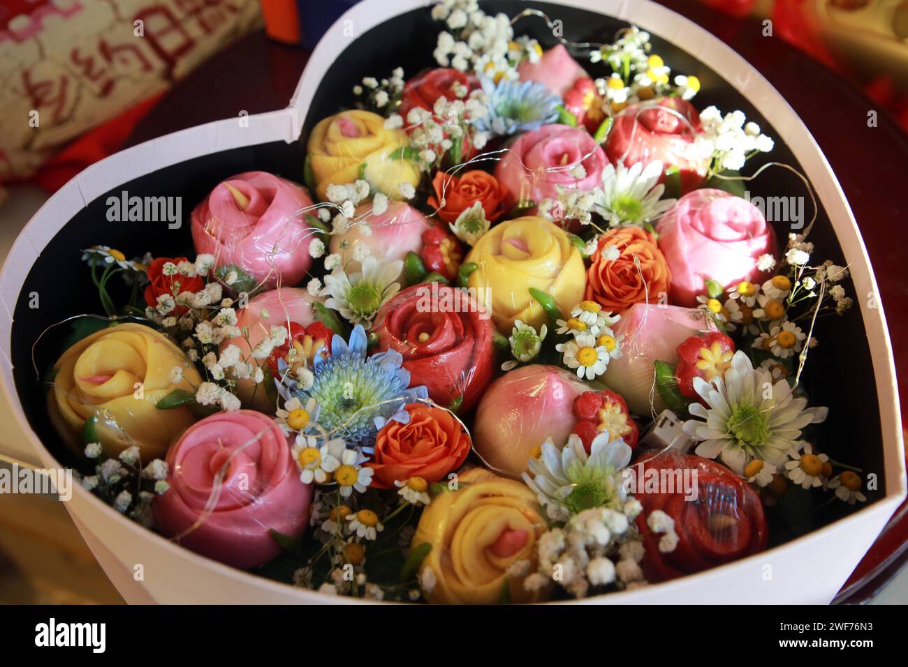 Flower-shaped steamed buns are made to celebrate the Spring Festival in ...