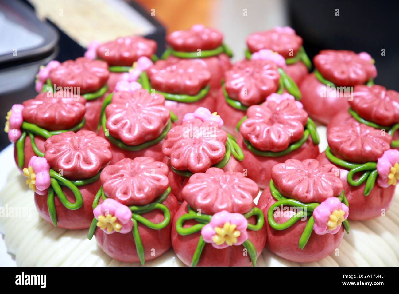 Flower-shaped steamed buns are made to celebrate the Spring Festival in ...