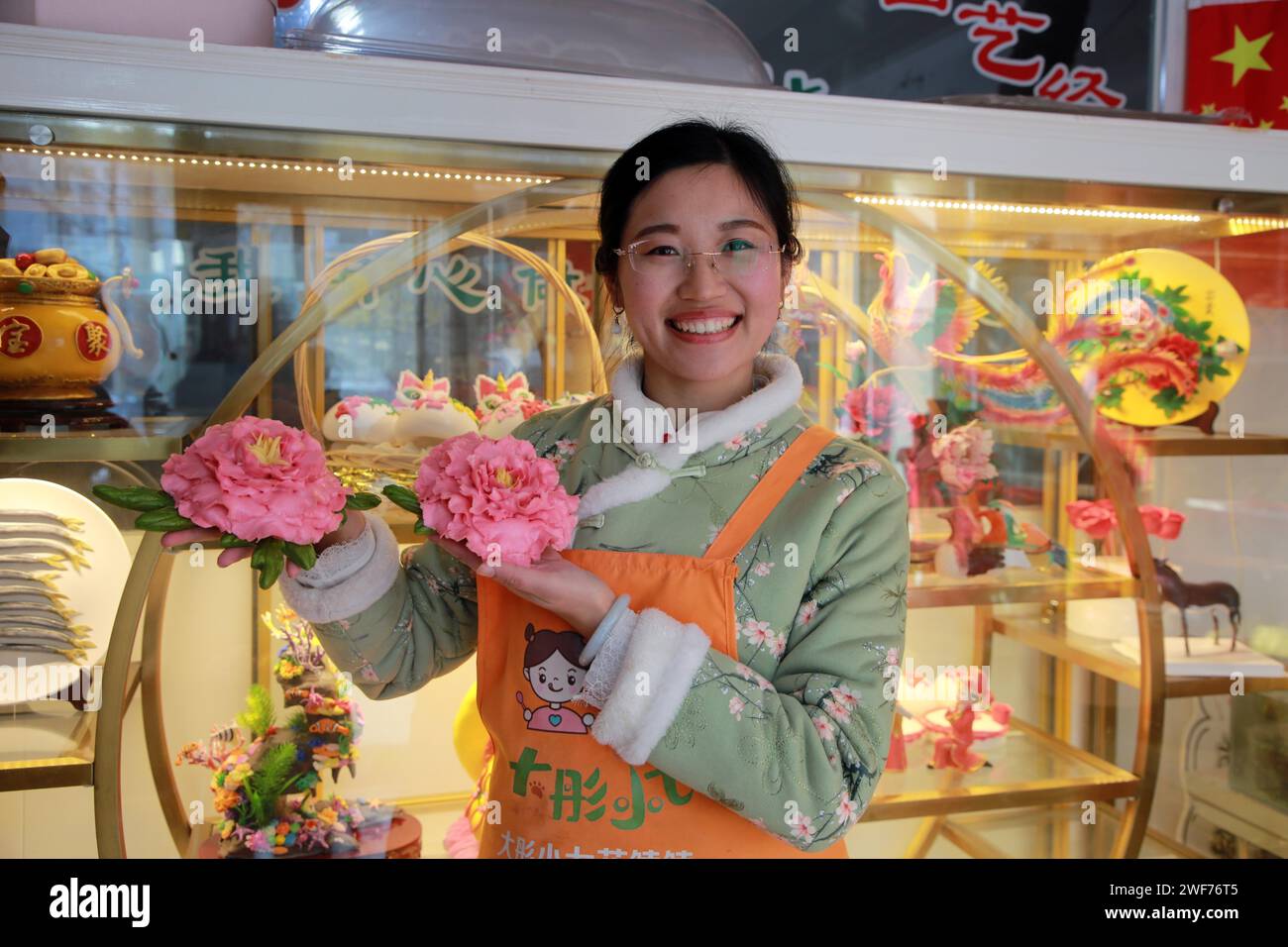 Flower-shaped steamed buns are made to celebrate the Spring Festival in Rizhao City, east China ...