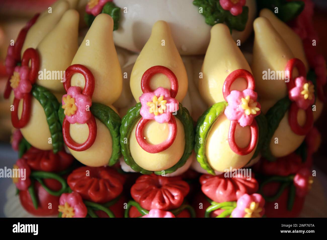 Flower-shaped steamed buns are made to celebrate the Spring Festival in ...