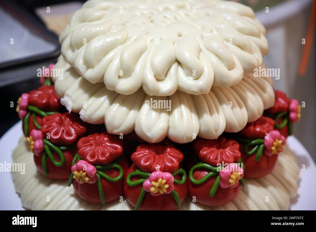 Flower-shaped steamed buns are made to celebrate the Spring Festival in ...