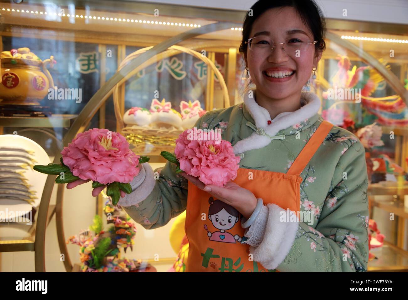 Flower-shaped steamed buns are made to celebrate the Spring Festival in ...