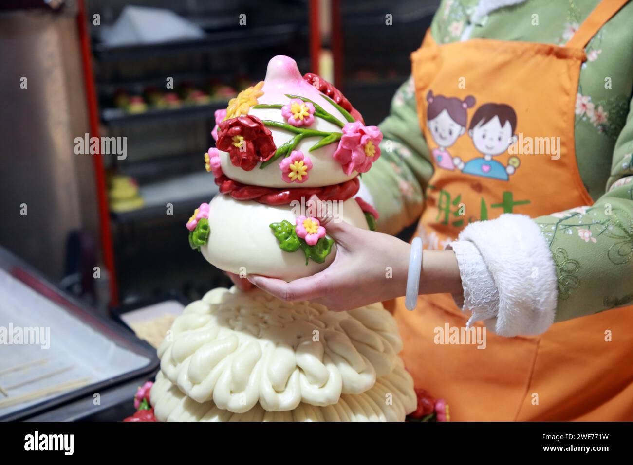 Flower-shaped steamed buns are made to celebrate the Spring Festival in ...
