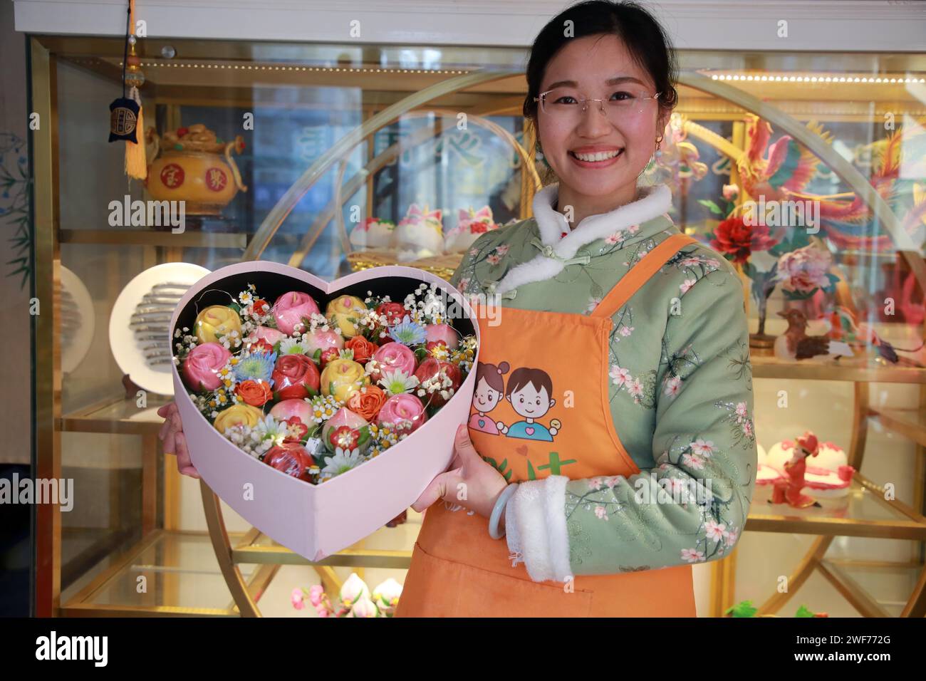 Flower-shaped steamed buns are made to celebrate the Spring Festival in ...