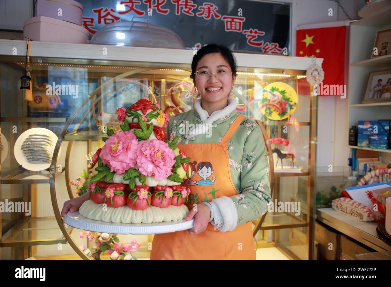 Flower-shaped steamed buns are made to celebrate the Spring Festival in ...