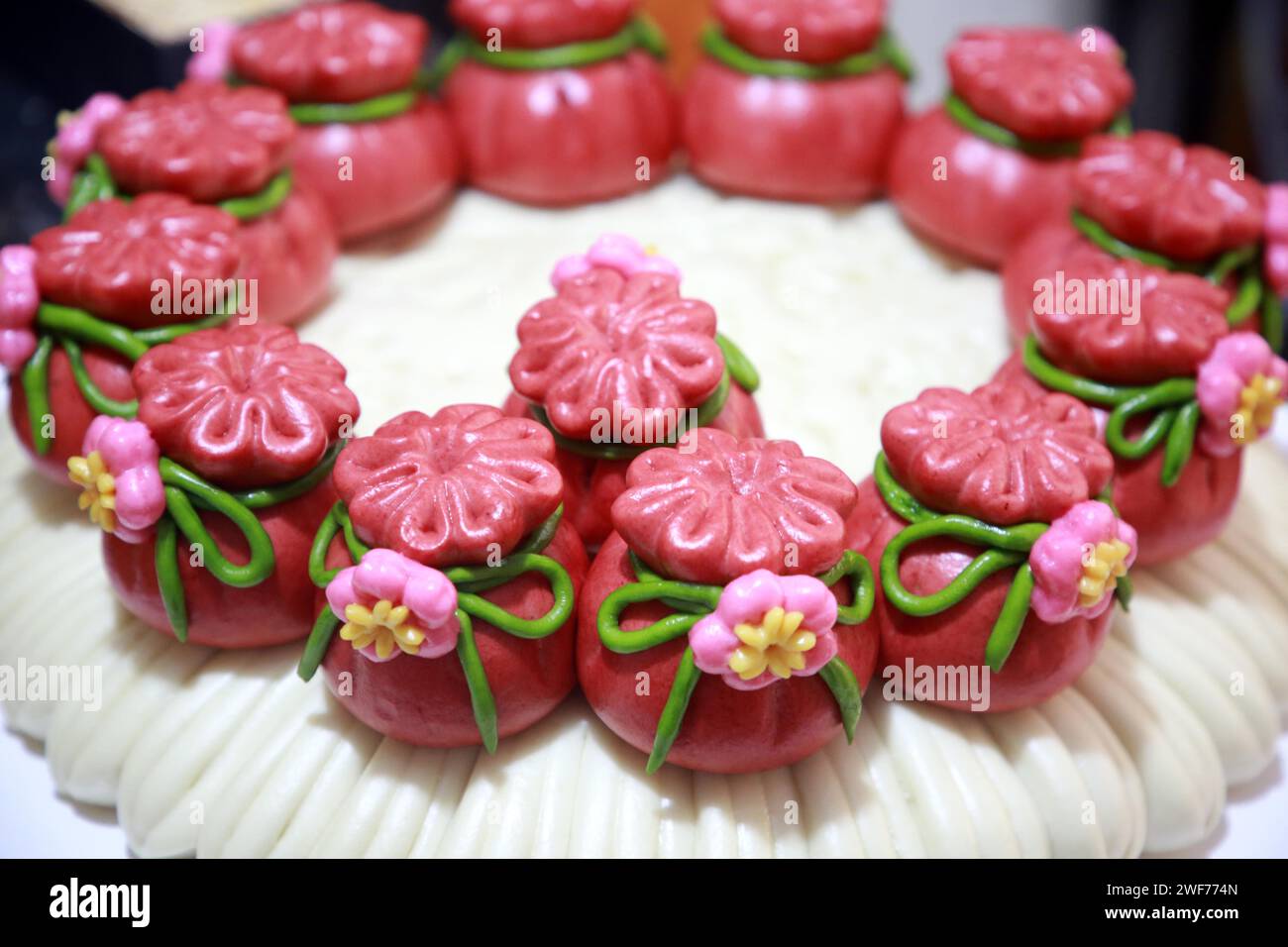 Flower-shaped steamed buns are made to celebrate the Spring Festival in ...