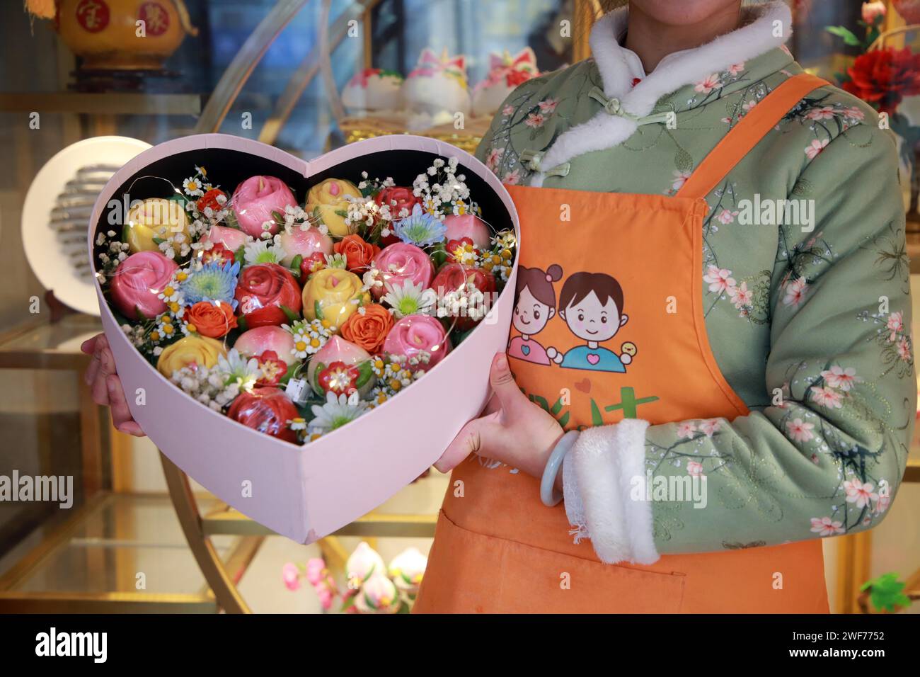 Flower-shaped steamed buns are made to celebrate the Spring Festival in ...