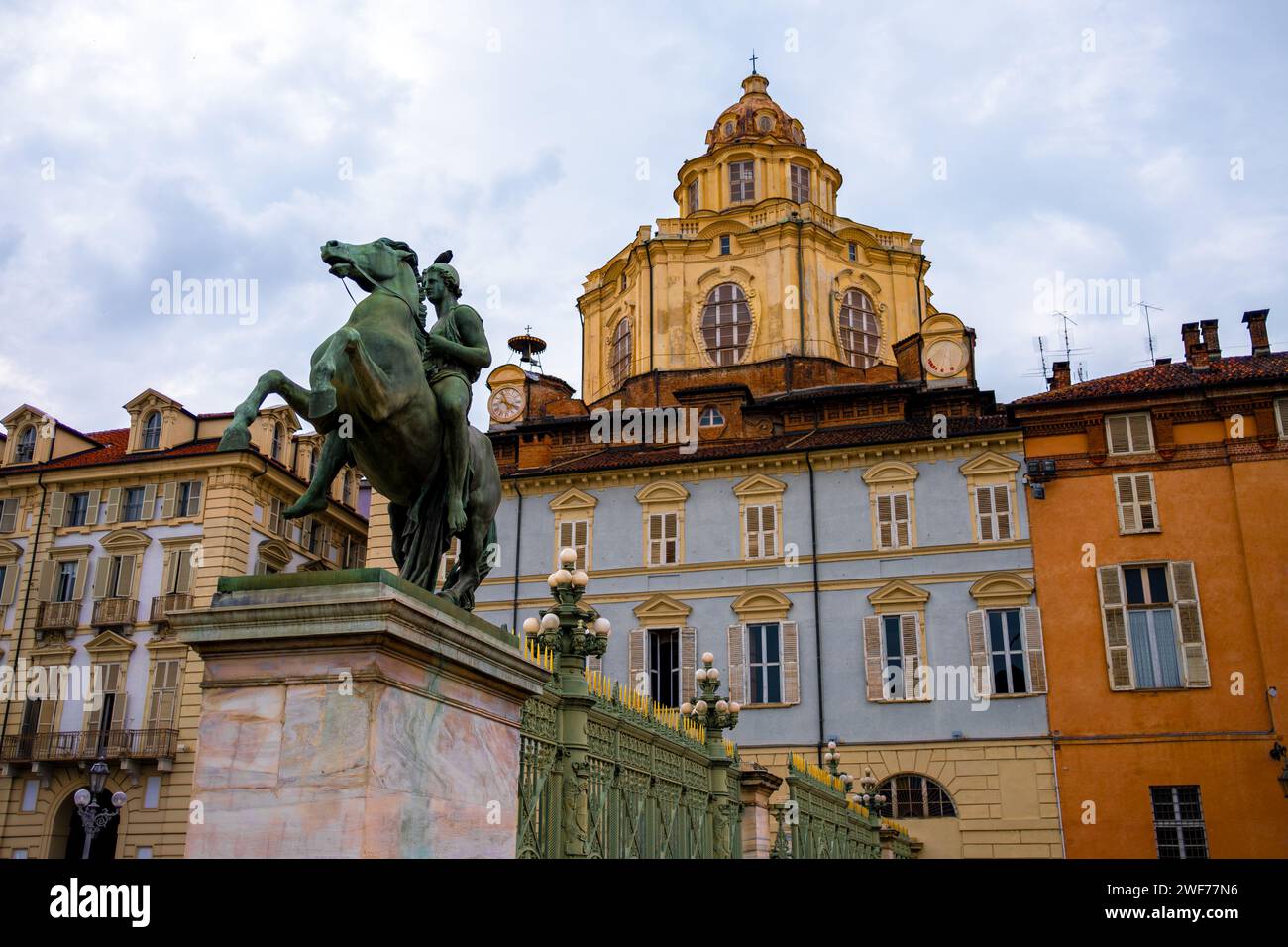The imposing equestrian statue foregrounds the magnificent Real Chiesa ...