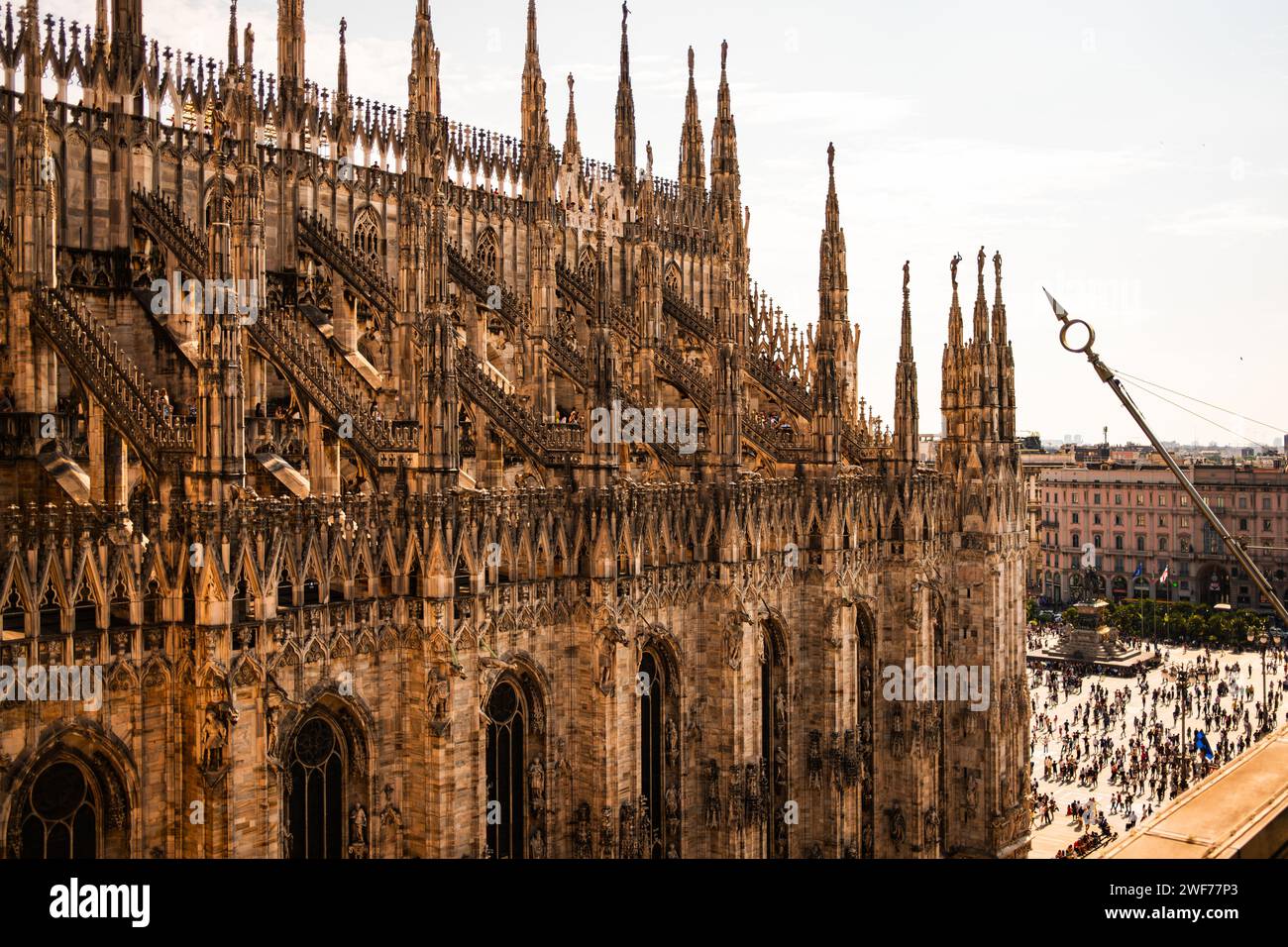 The intricate spires of the Duomo di Milano rise dramatically above ...