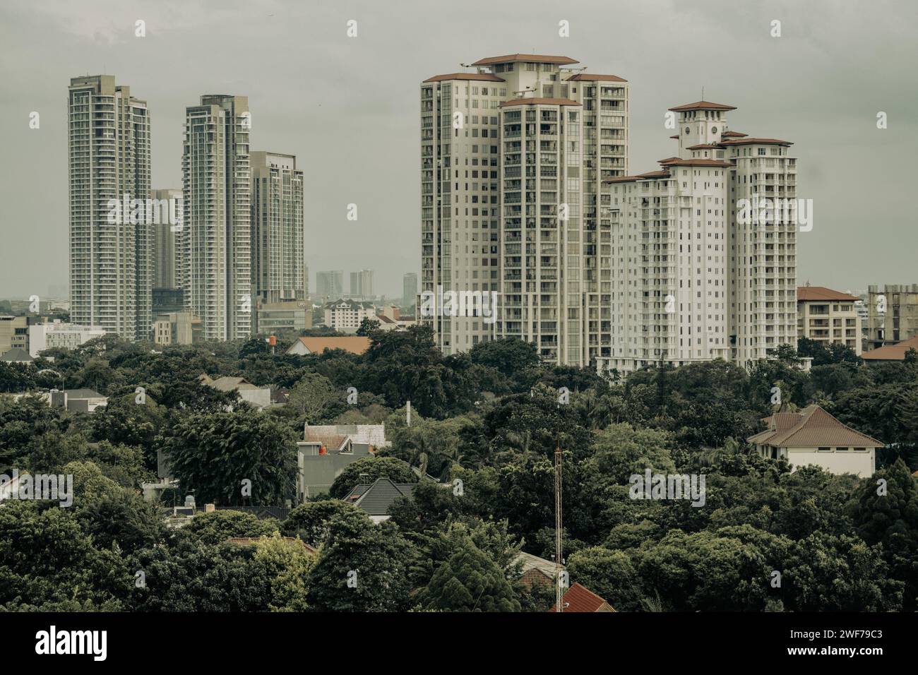 Building with many tree bellow Stock Photo - Alamy