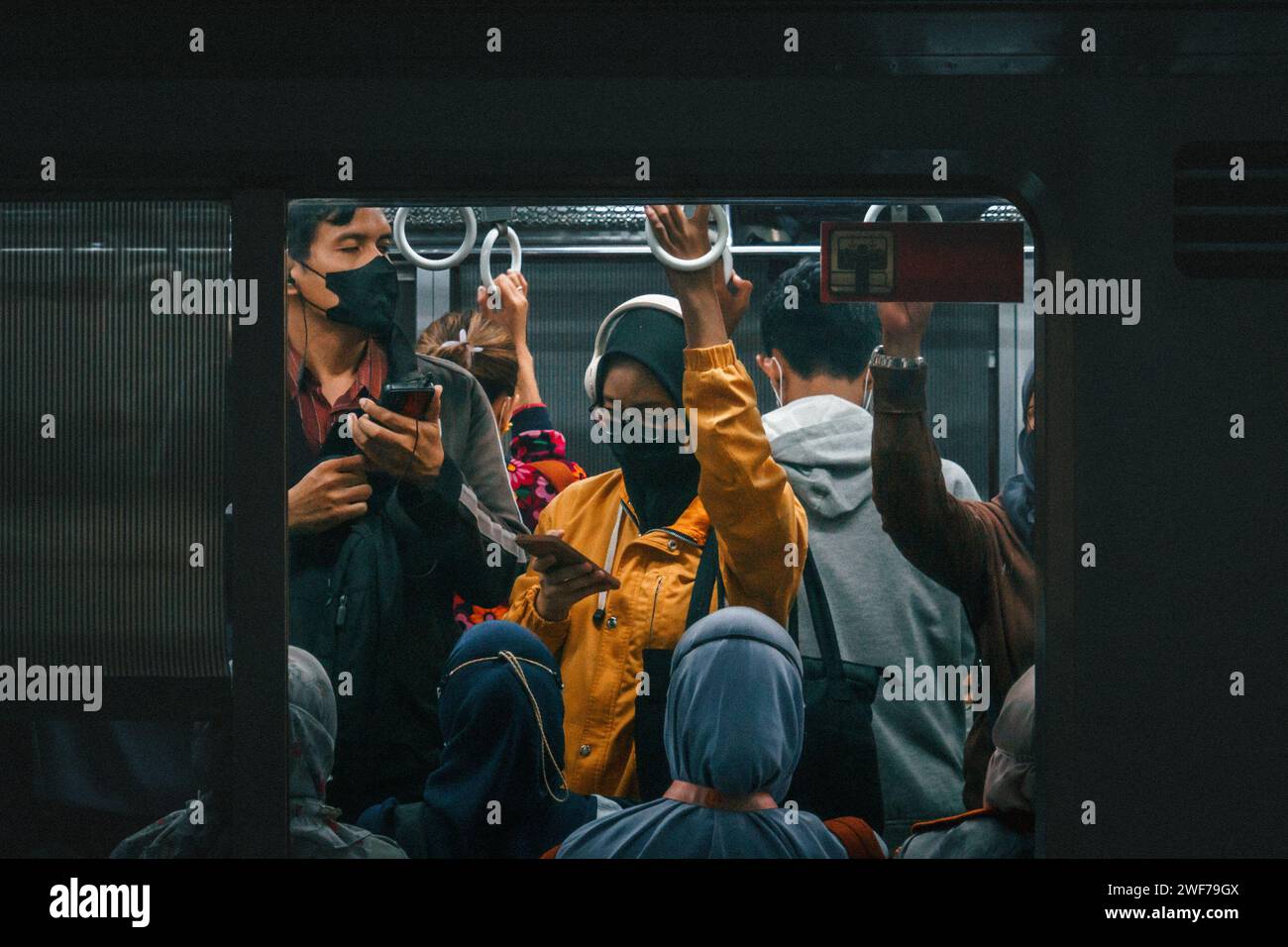 People inside metro train at night Stock Photo - Alamy