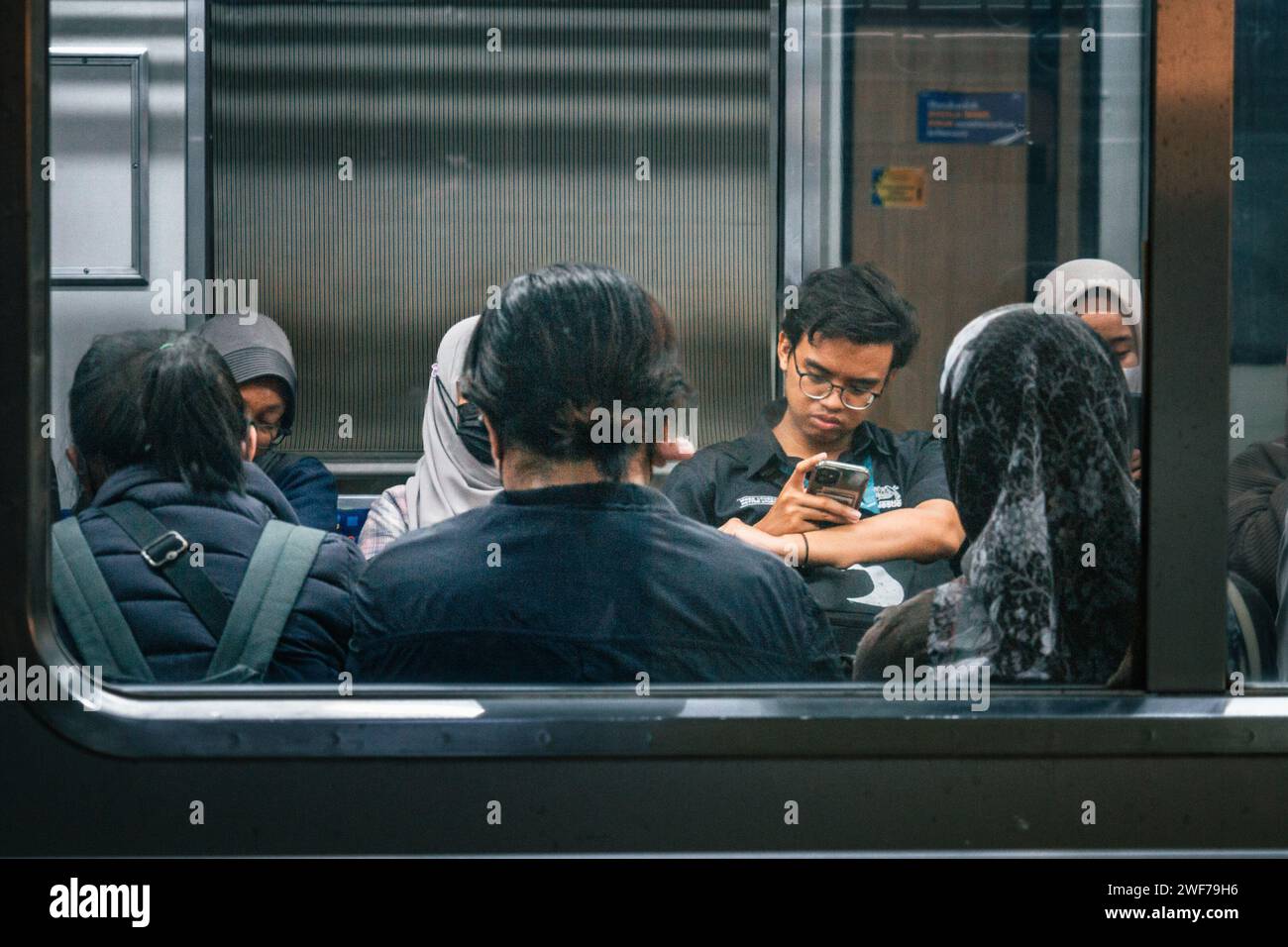 People inside metro train at night Stock Photo - Alamy