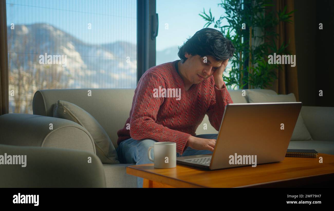 Distracted college student working from home using with laptop while ...