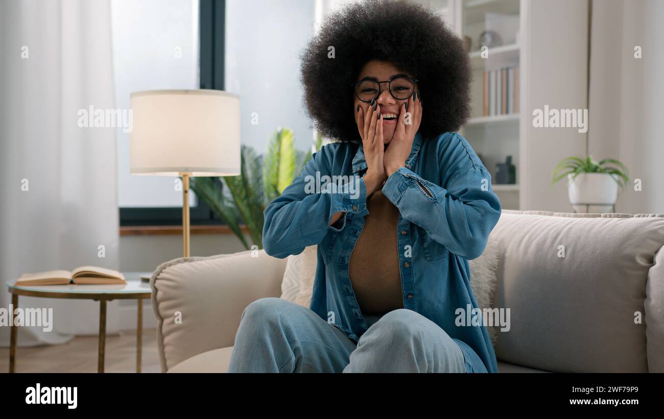 Amazed African American woman lady girl shocked close mouth with hands ...