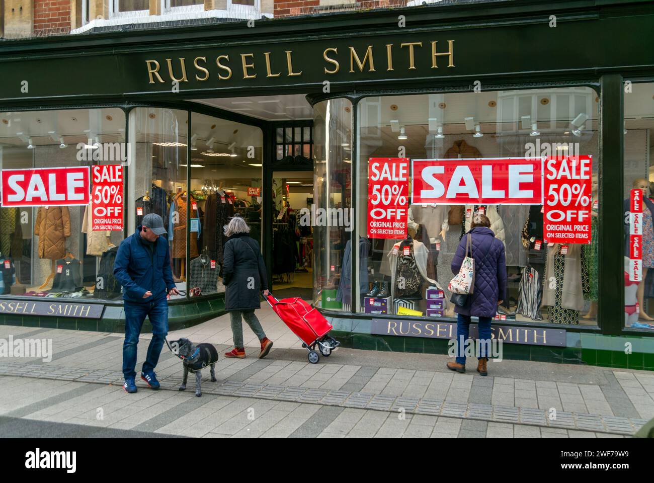 Sale poster signs in shop window of Russell Smith clothing store ...